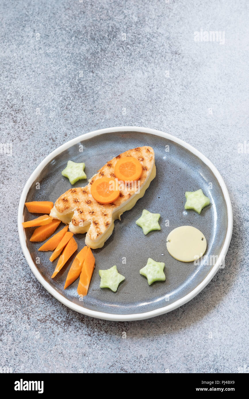Boy eating grilled cheese lunch hi-res stock photography and images - Alamy