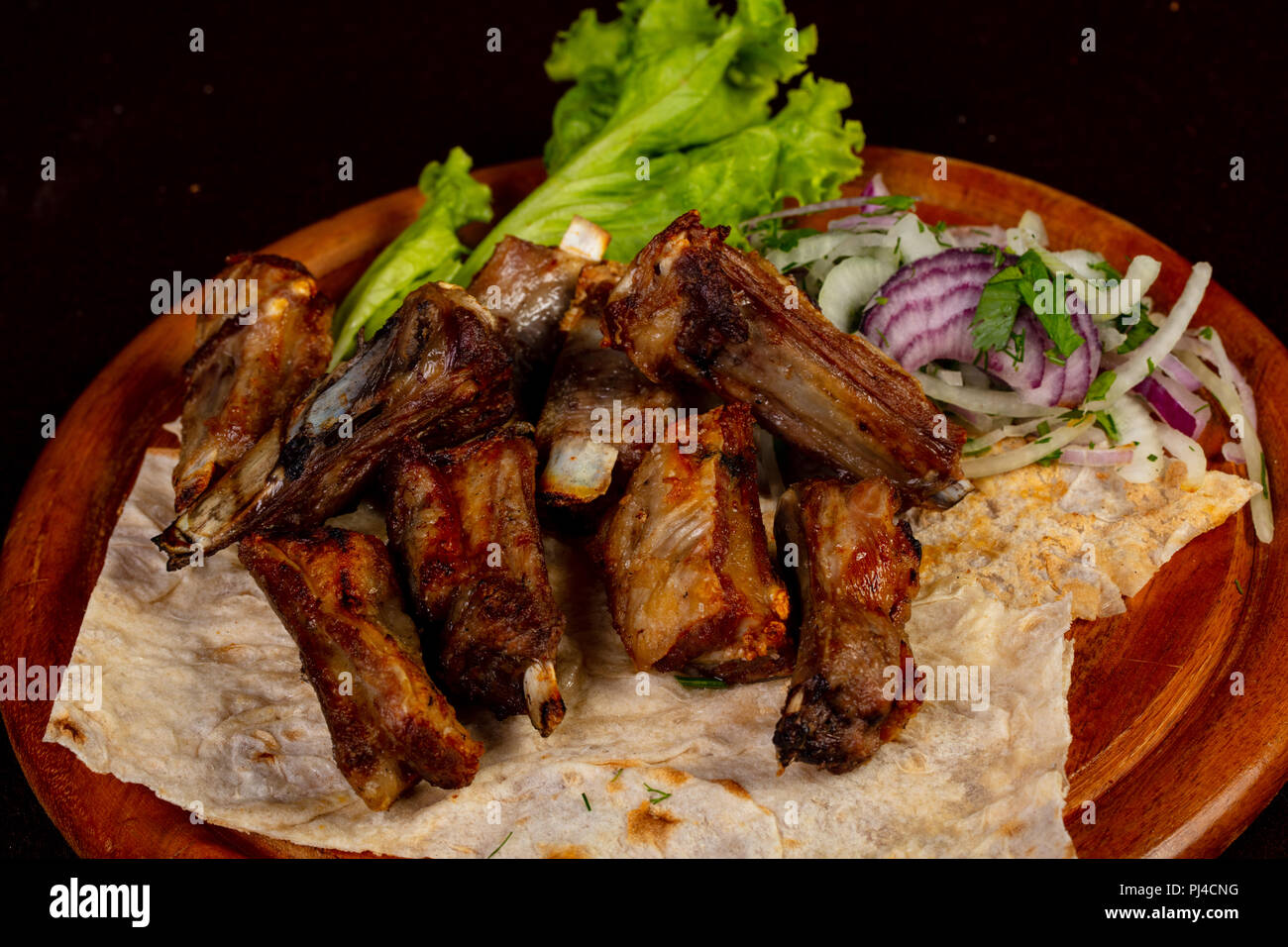 Grilled Mutton ribs with onion Stock Photo - Alamy