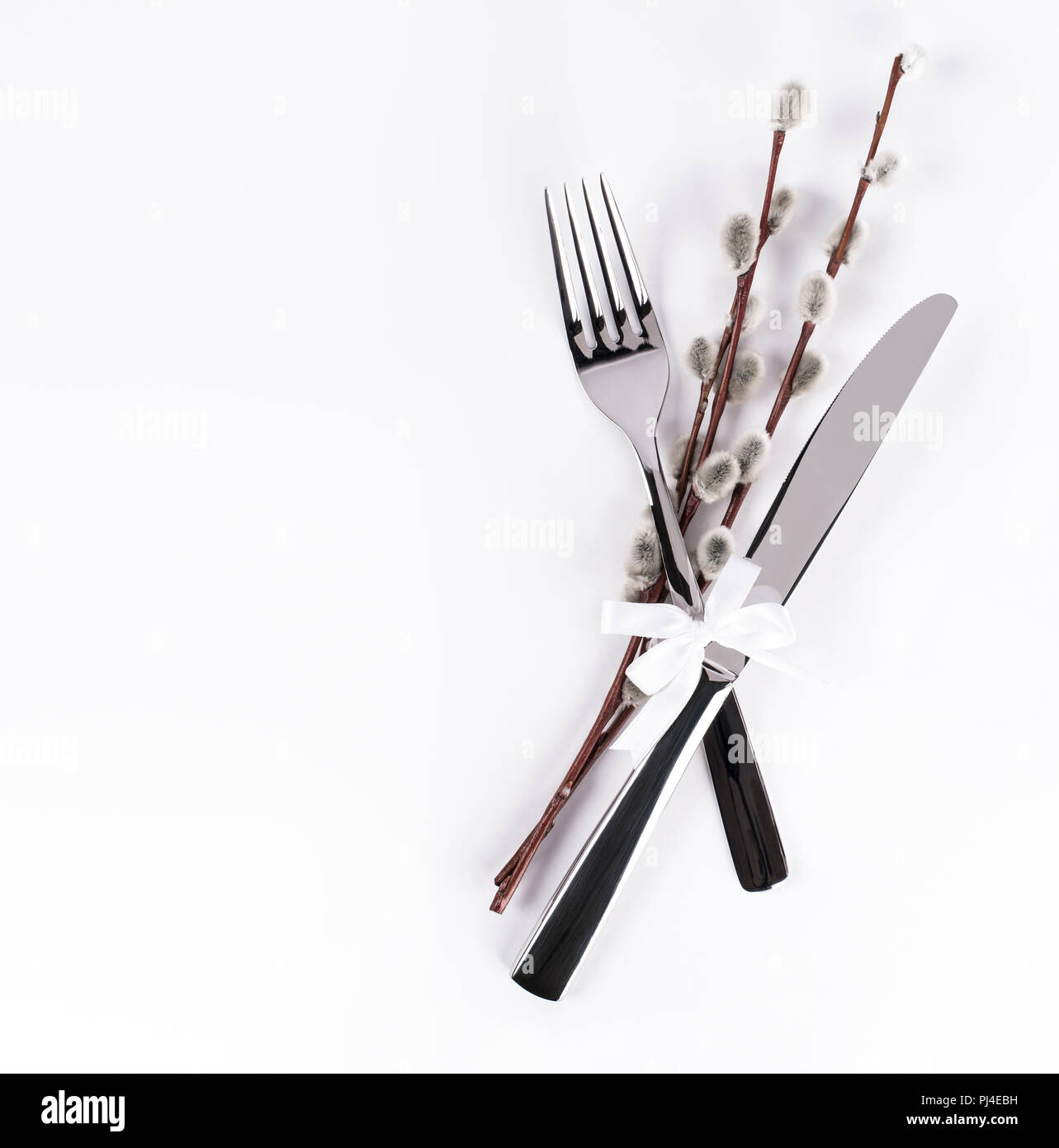 Spring silverware on white background and willow Stock Photo - Alamy