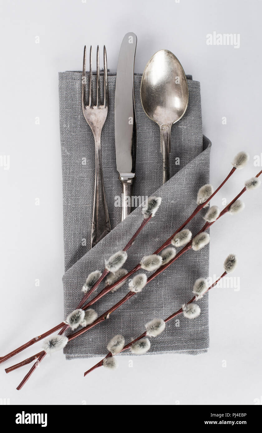 Vintage silverware in grey napkin envelope and willow Stock Photo - Alamy