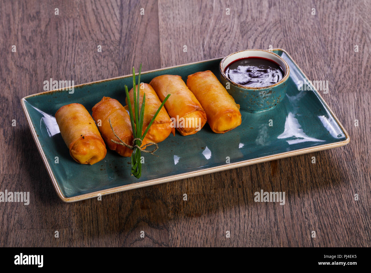 Spring roll with sauce served onion Stock Photo - Alamy