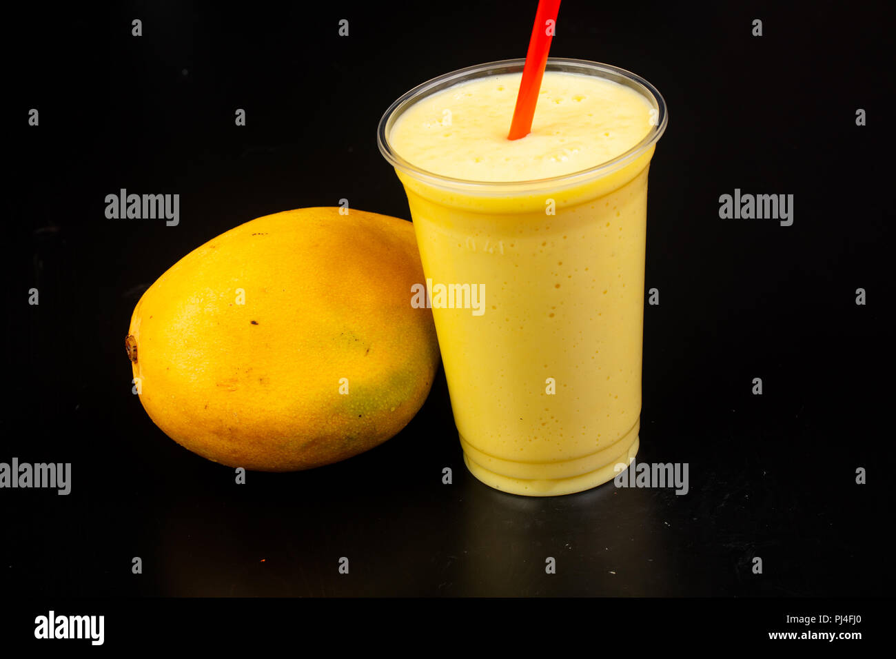 Sweet cold mango shake juice Stock Photo - Alamy
