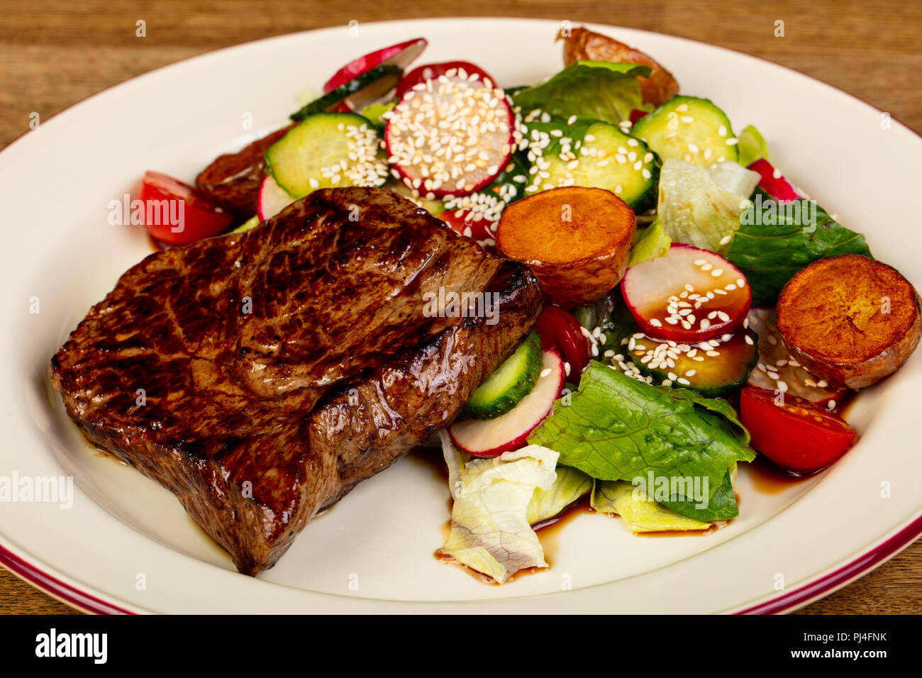 Beef steak salad with radish Stock Photo - Alamy