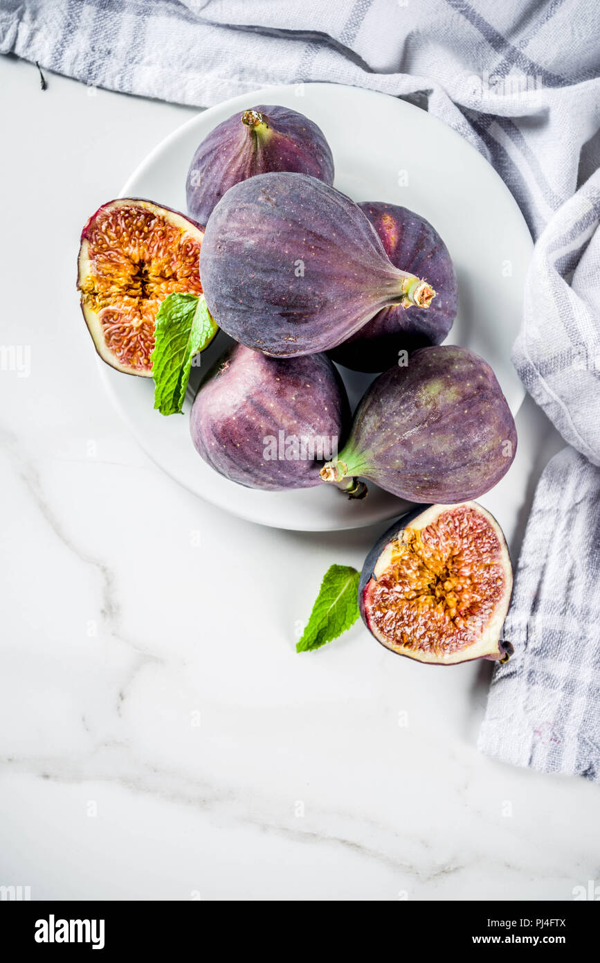 Raw fresh figs fruits on white marble background copy space Stock Photo ...