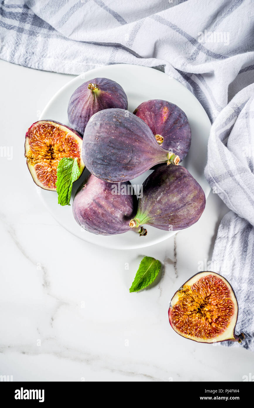Raw fresh figs fruits on white marble background copy space Stock Photo ...