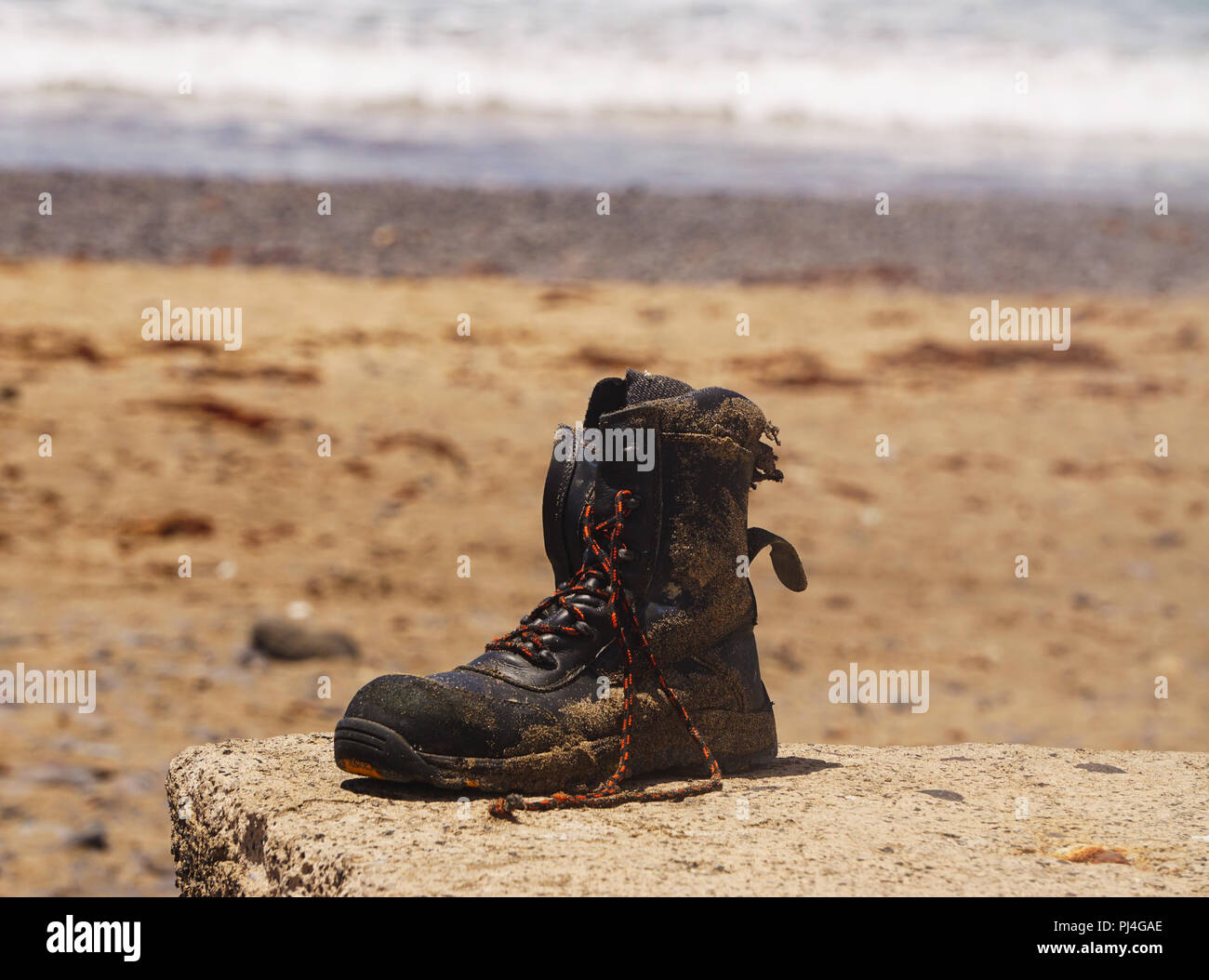A boot on the beach Stock Photo - Alamy
