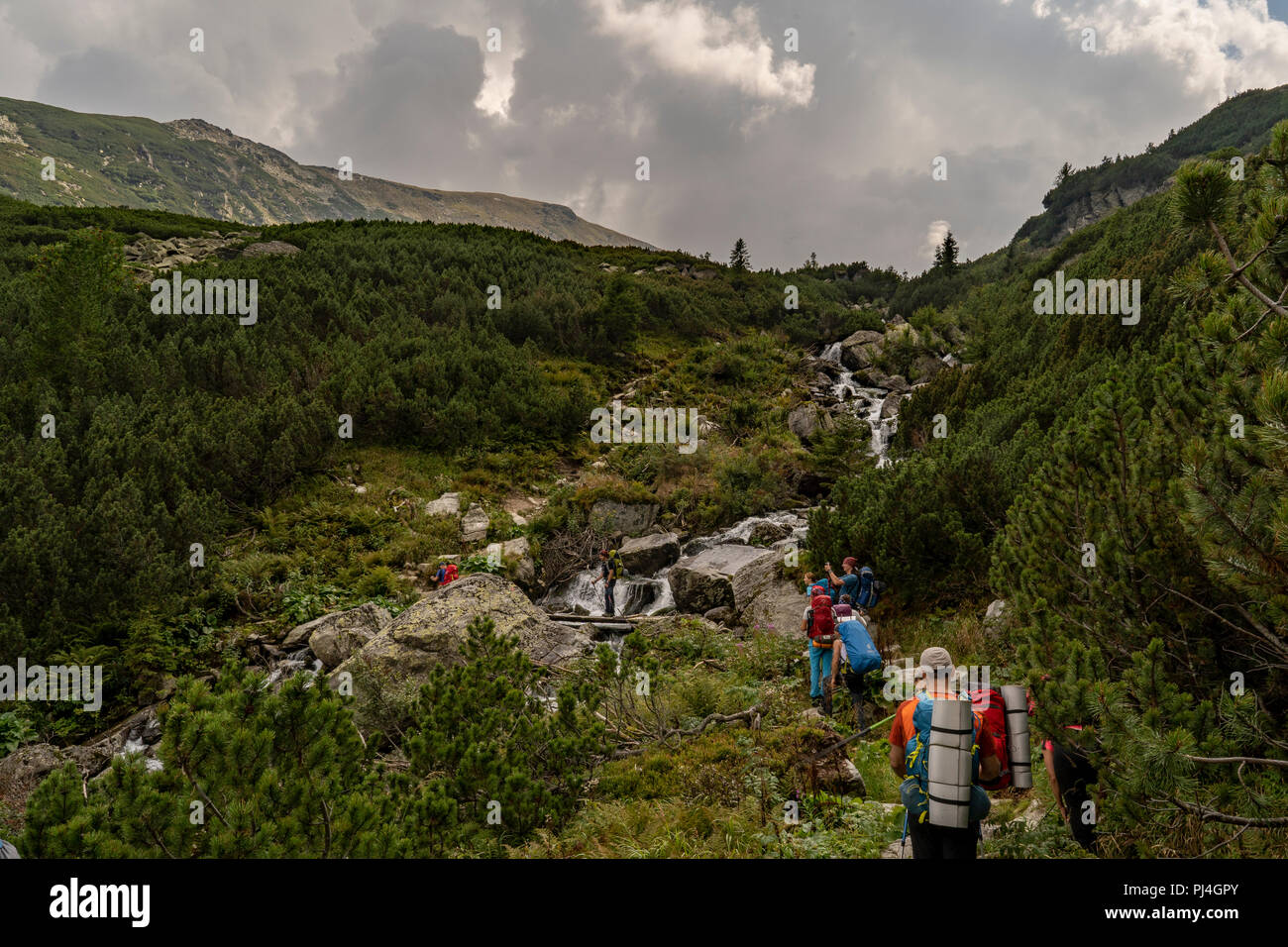 Hikers enthusiasts reach Parangul Mare, 2519m altitude, during a 3 days ...