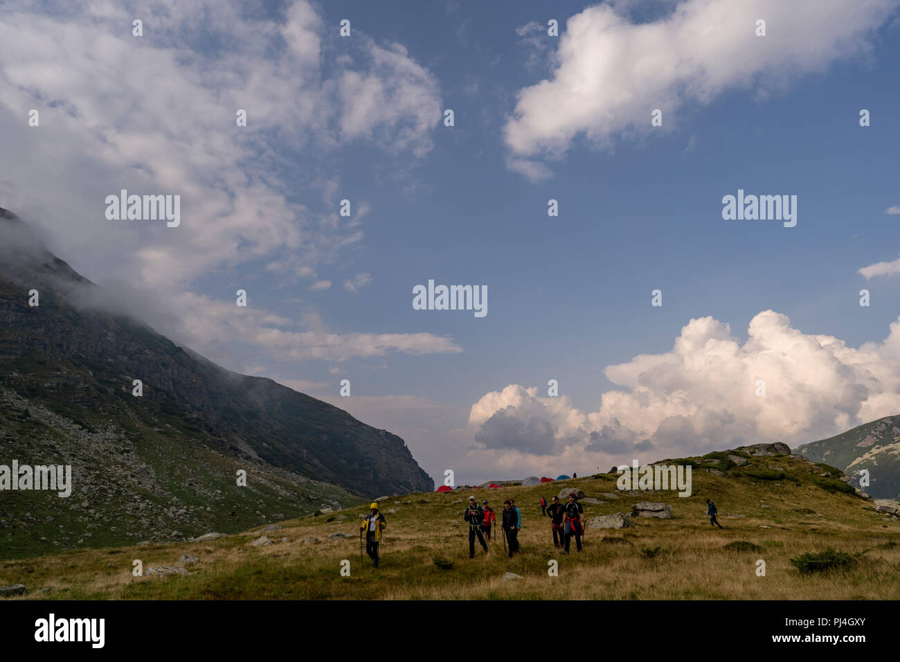 Hikers enthusiasts reach Parangul Mare, 2519m altitude, during a 3 days ...