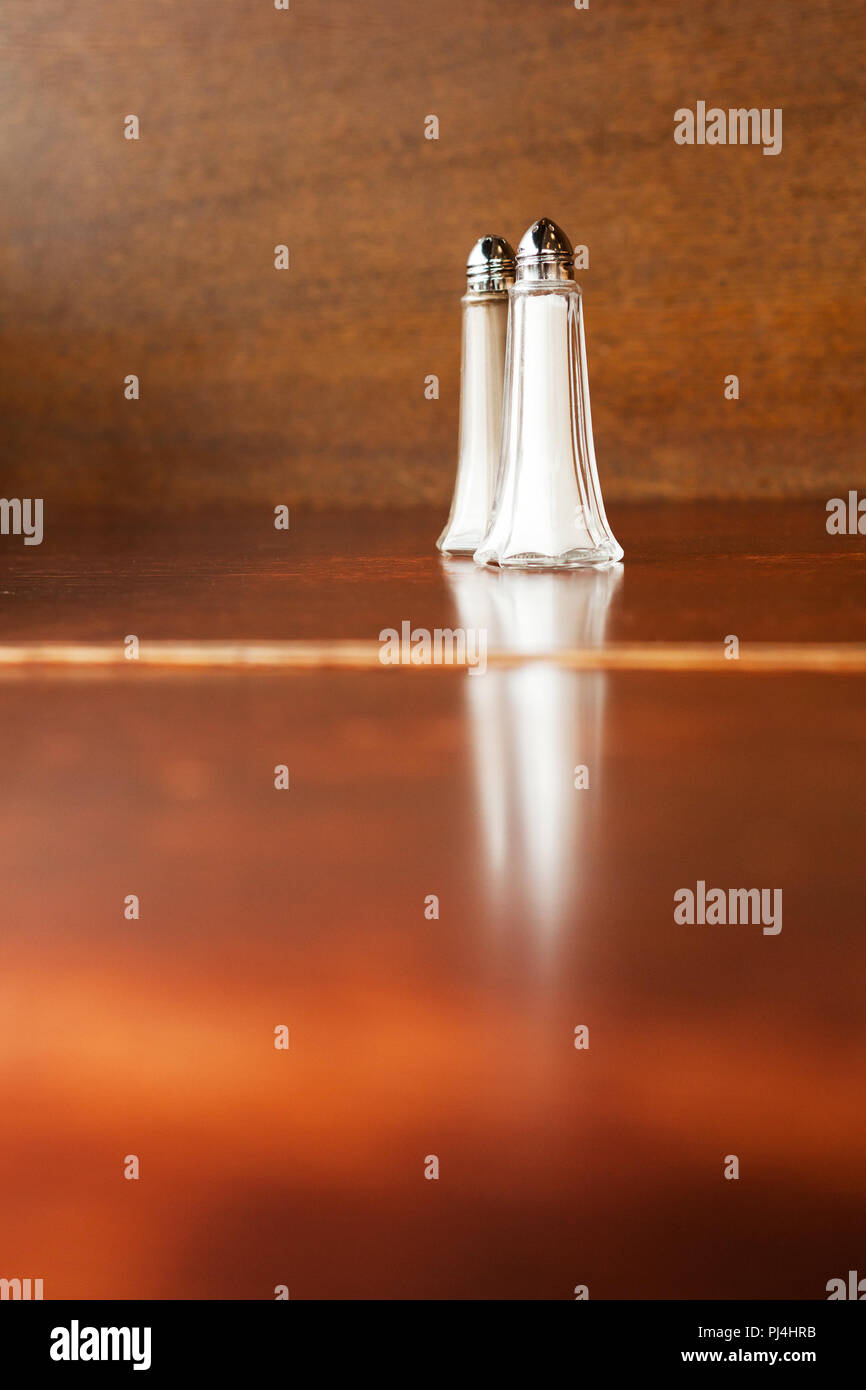 Pepper and salt shakers on restaurant table Stock Photo - Alamy
