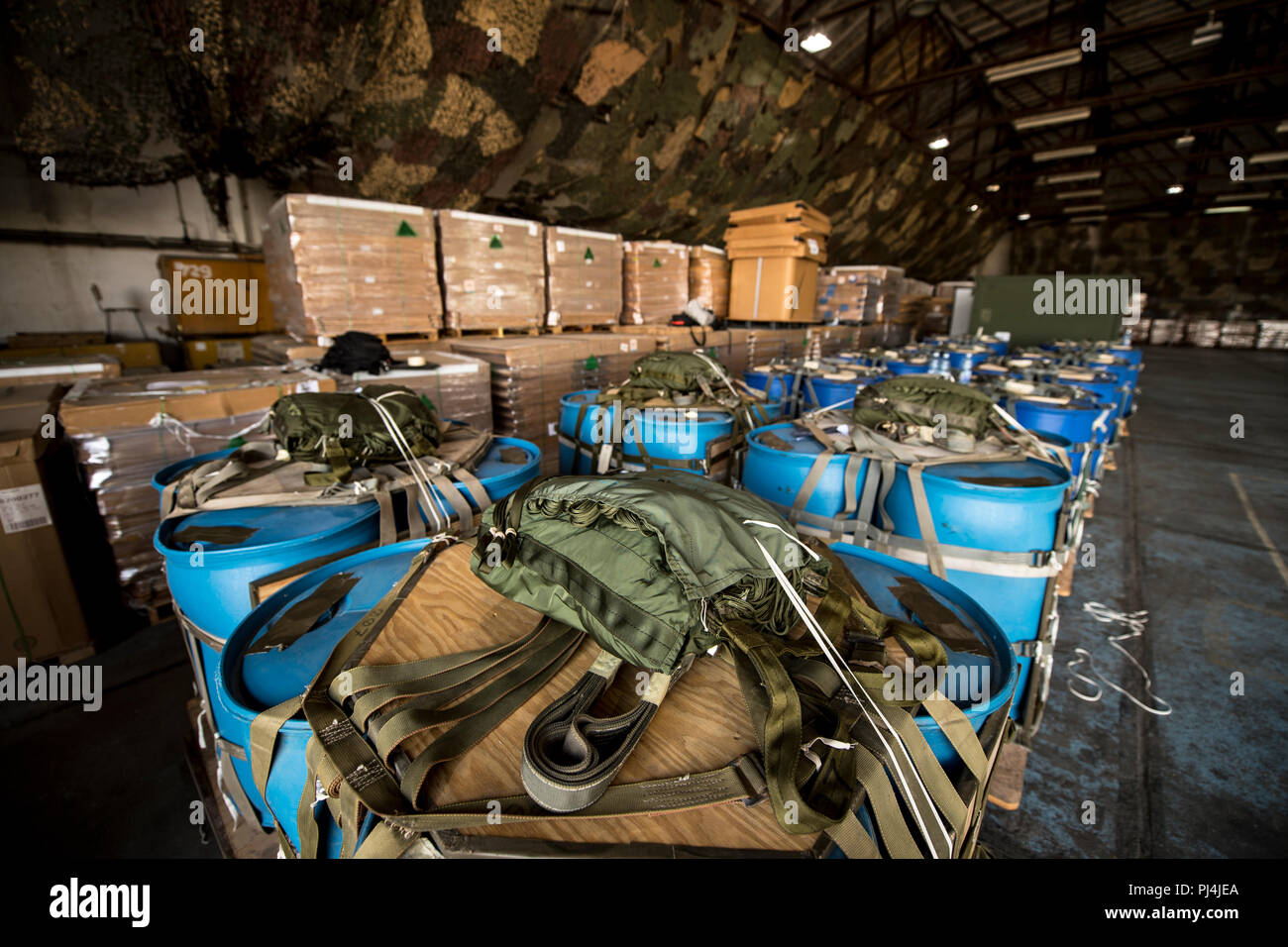 Multiple container delivery system bundles sit in a hangar at Otopeni ...