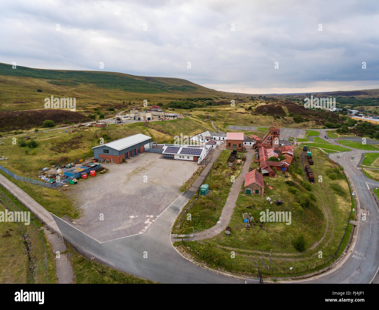 An aerial view of an Old Coal Mine Pit Yard on overcast Day, Blaenavon ...