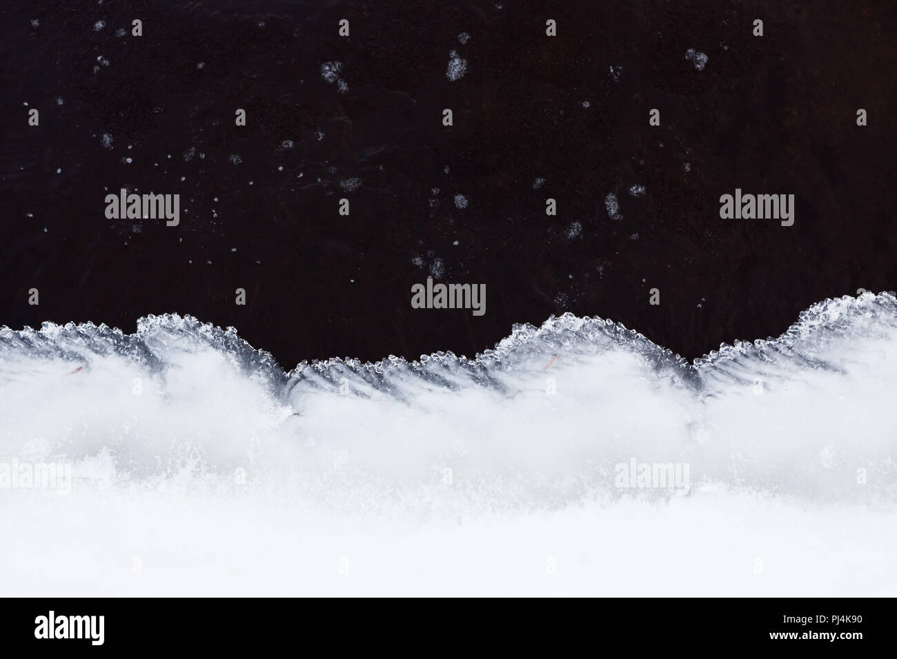 Ice edge on water background Stock Photo - Alamy