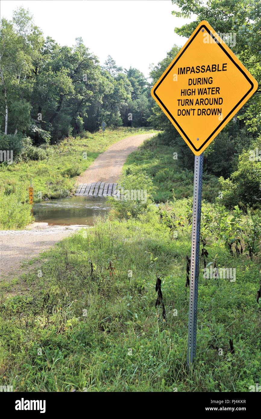 A sign indicating a warning for a water crossing is shown Aug. 28, 2018 ...