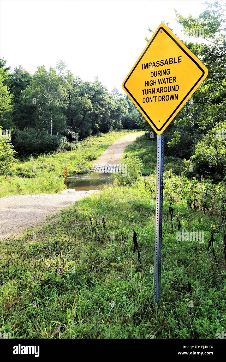 A sign indicating a warning for a water crossing is shown Aug. 28, 2018 ...
