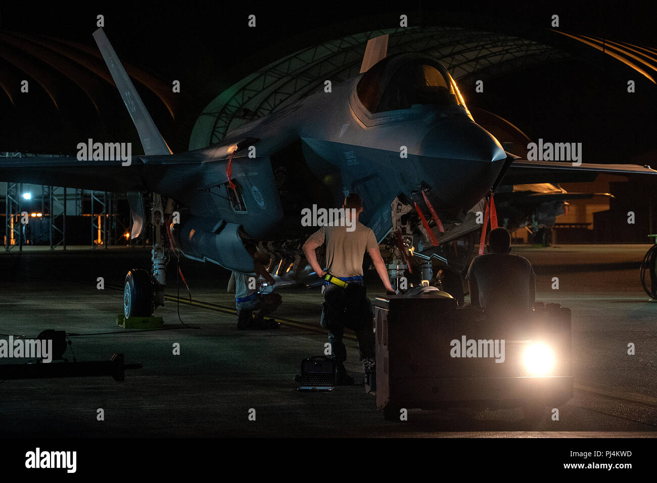 33rd Aircraft Maintenance Squadron weapons load crew members stand in ...