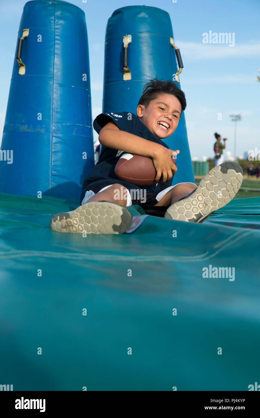 A child of a service member participates in the Chargers NFL’s ‘Play 60 ...