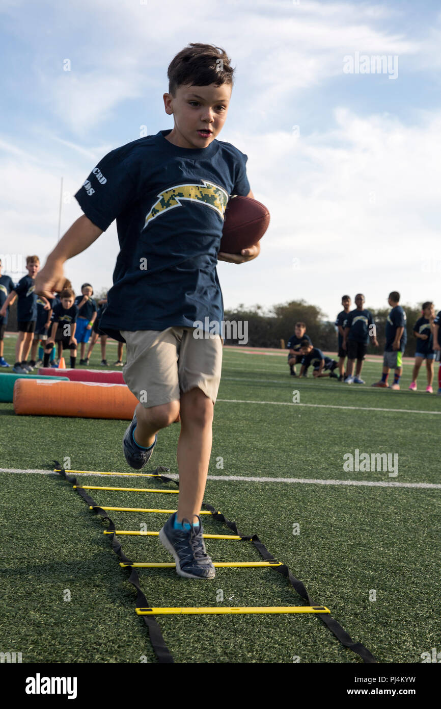 A child of a service member participates in the Chargers NFL’s ‘Play 60 ...