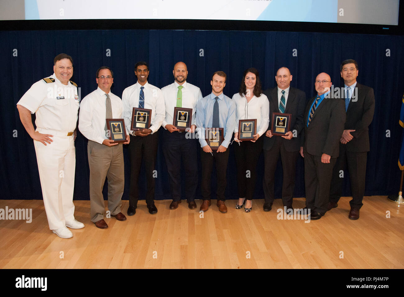 The LHA 6 Total Ship Survivability Trial (TSST) Team receives the ...