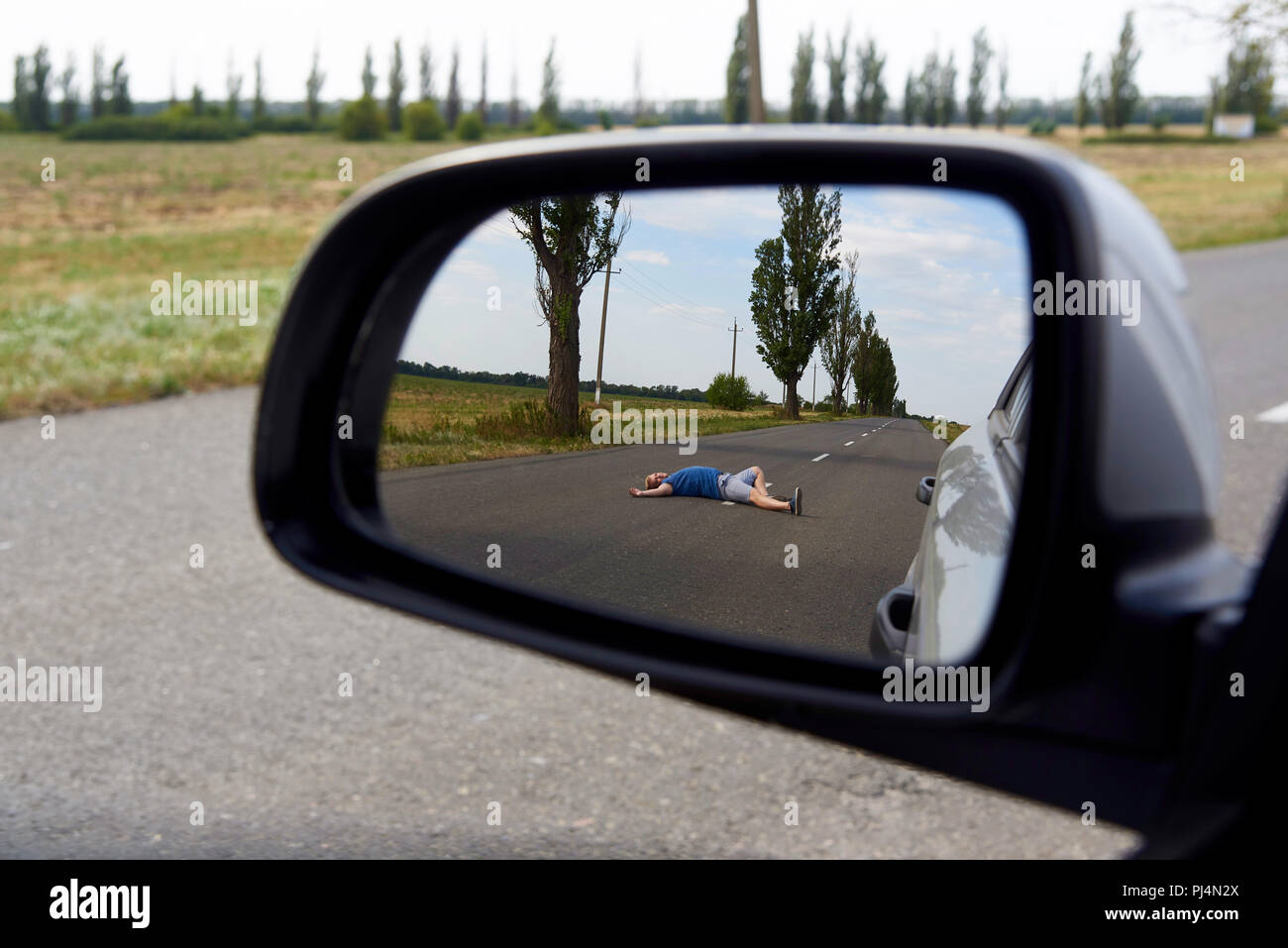 Rearview mirror with a man hit by a car. Сar accident concept Stock ...