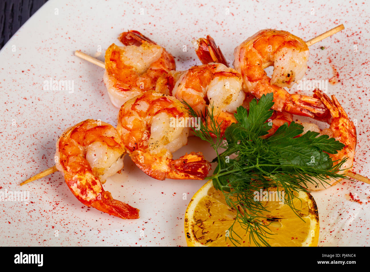 Tasty tiger prawn with garlic sauce Stock Photo - Alamy