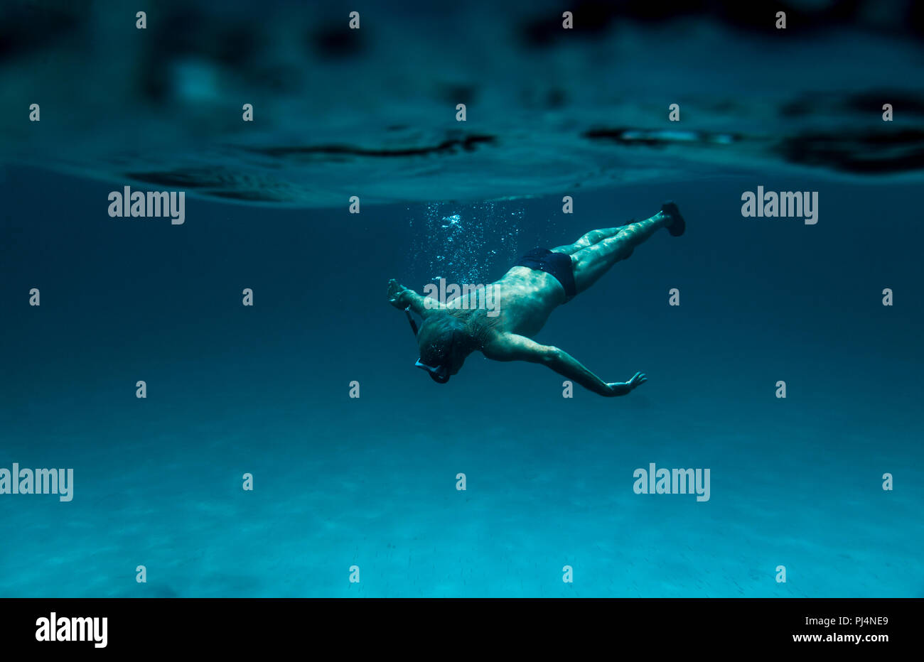 Person Floating Underwater