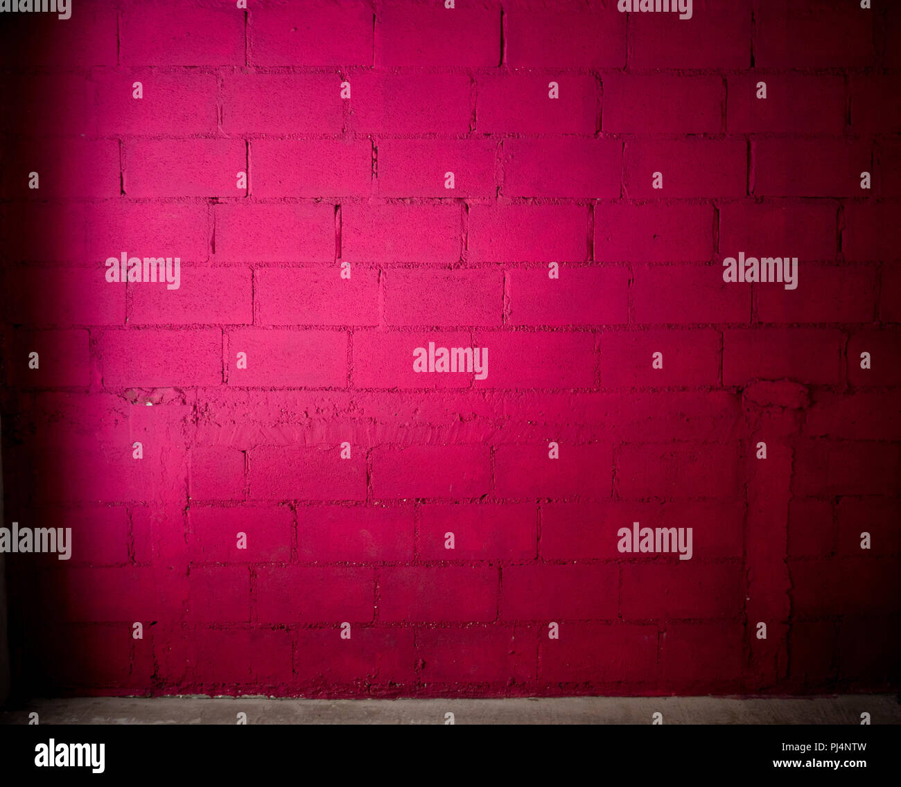 magenta color brick wall background with concrete floor Stock Photo - Alamy