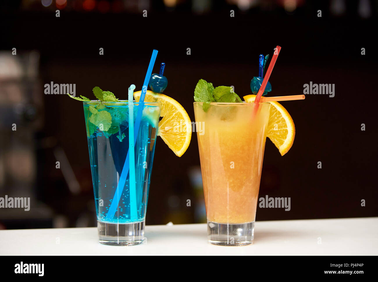 Bright cocktails on a bar counter against a dark background Stock Photo ...