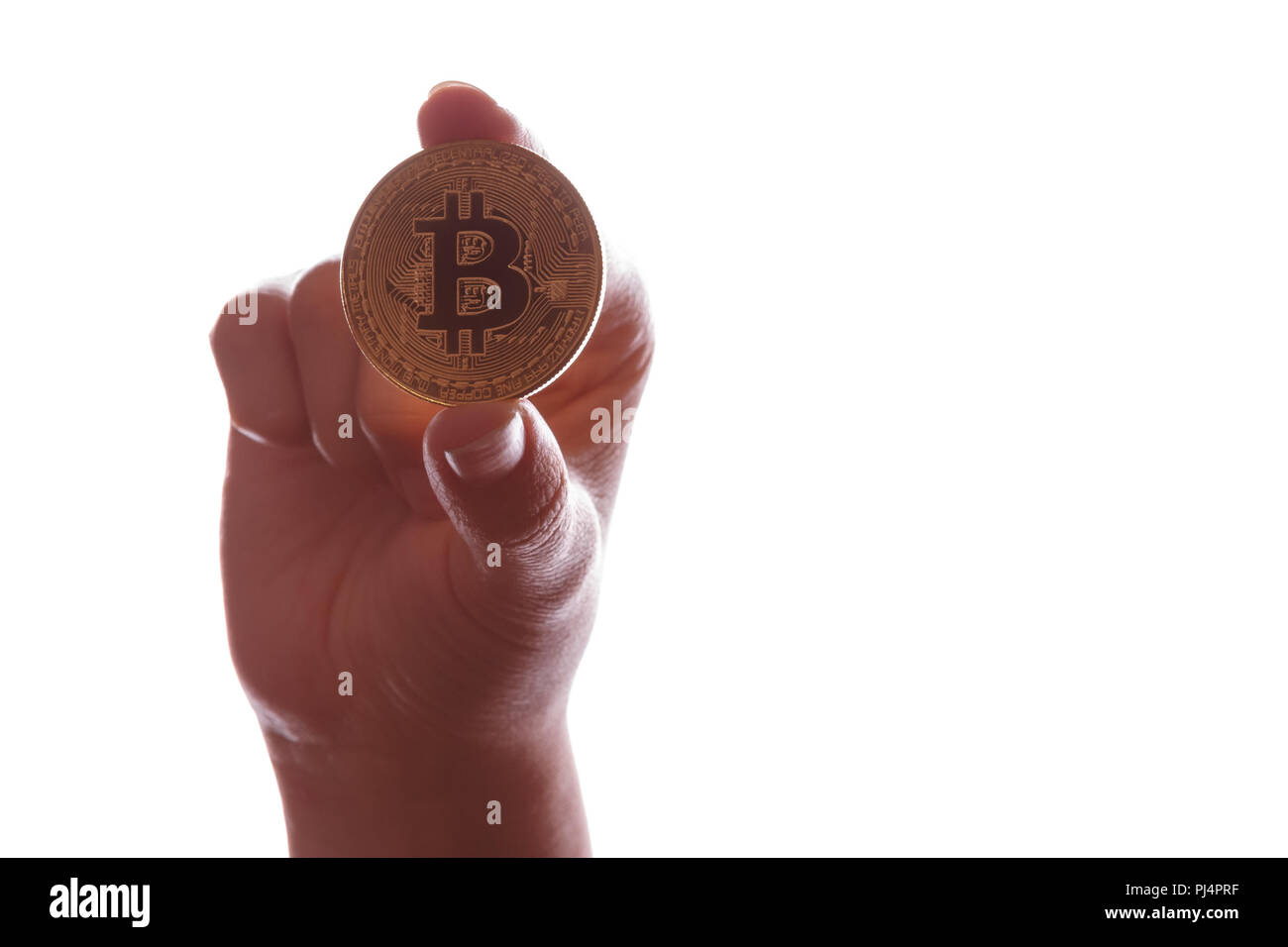 Bitcoin BTC coin of crypto currency in hand on a white background Stock ...