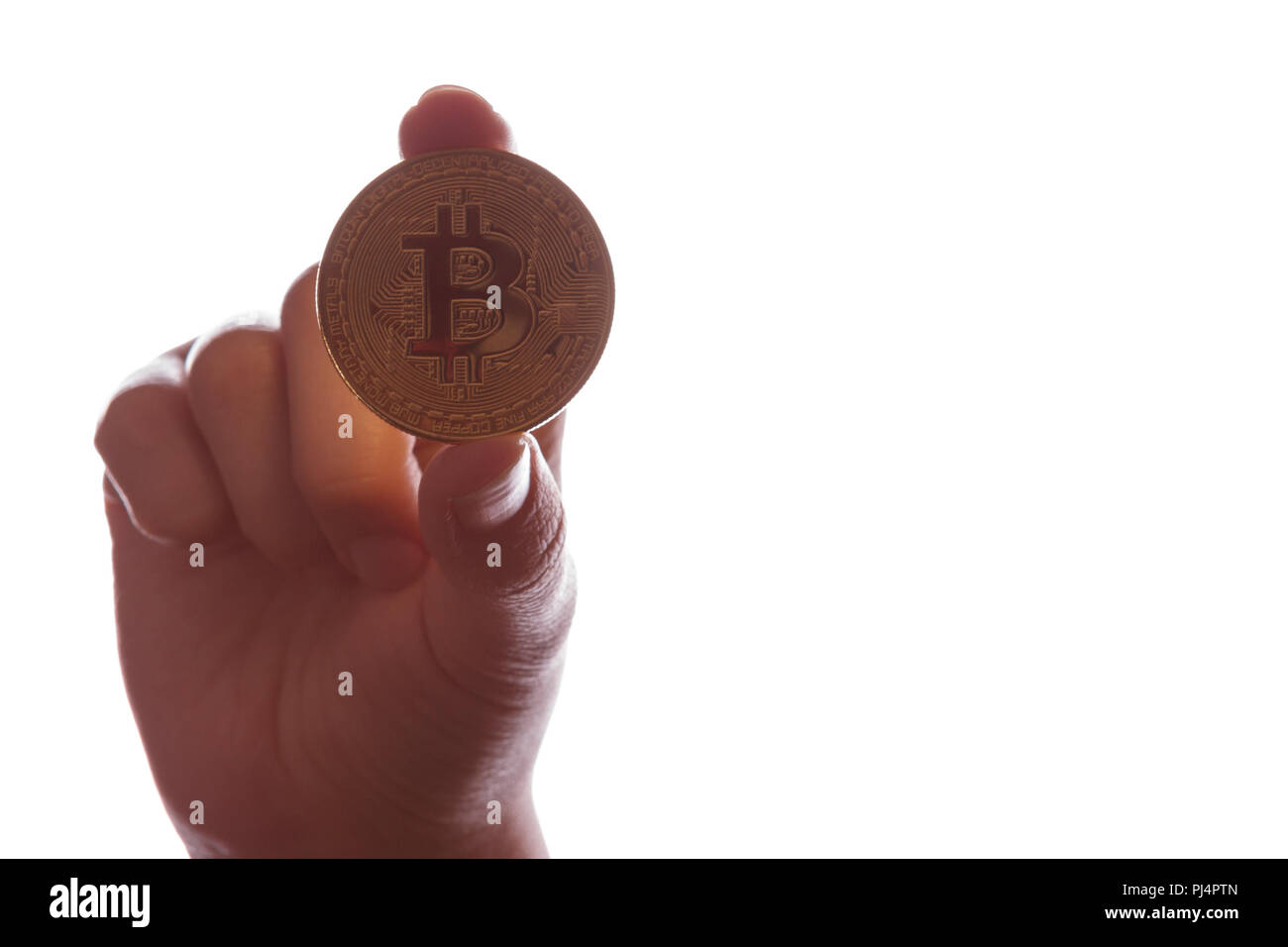 Bitcoin BTC in a girl's hand on a white background Stock Photo - Alamy