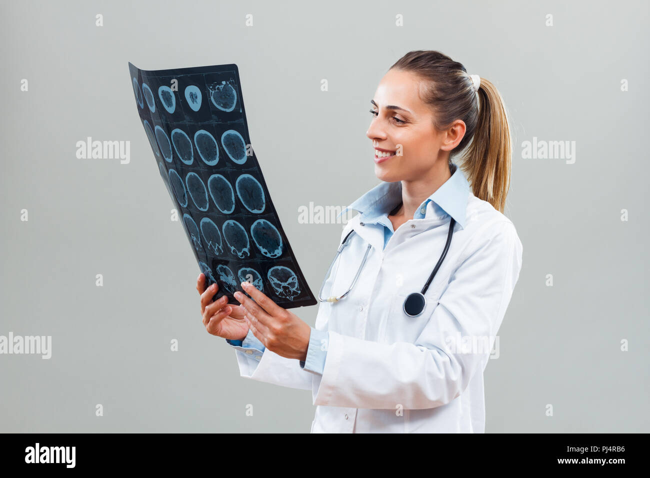 Portrait of beautiful female doctor holding x-ray Stock Photo - Alamy