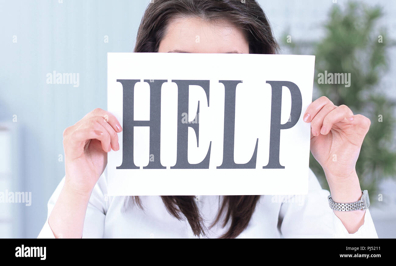 smiling business woman showing a sheet with the word help Stock Photo ...