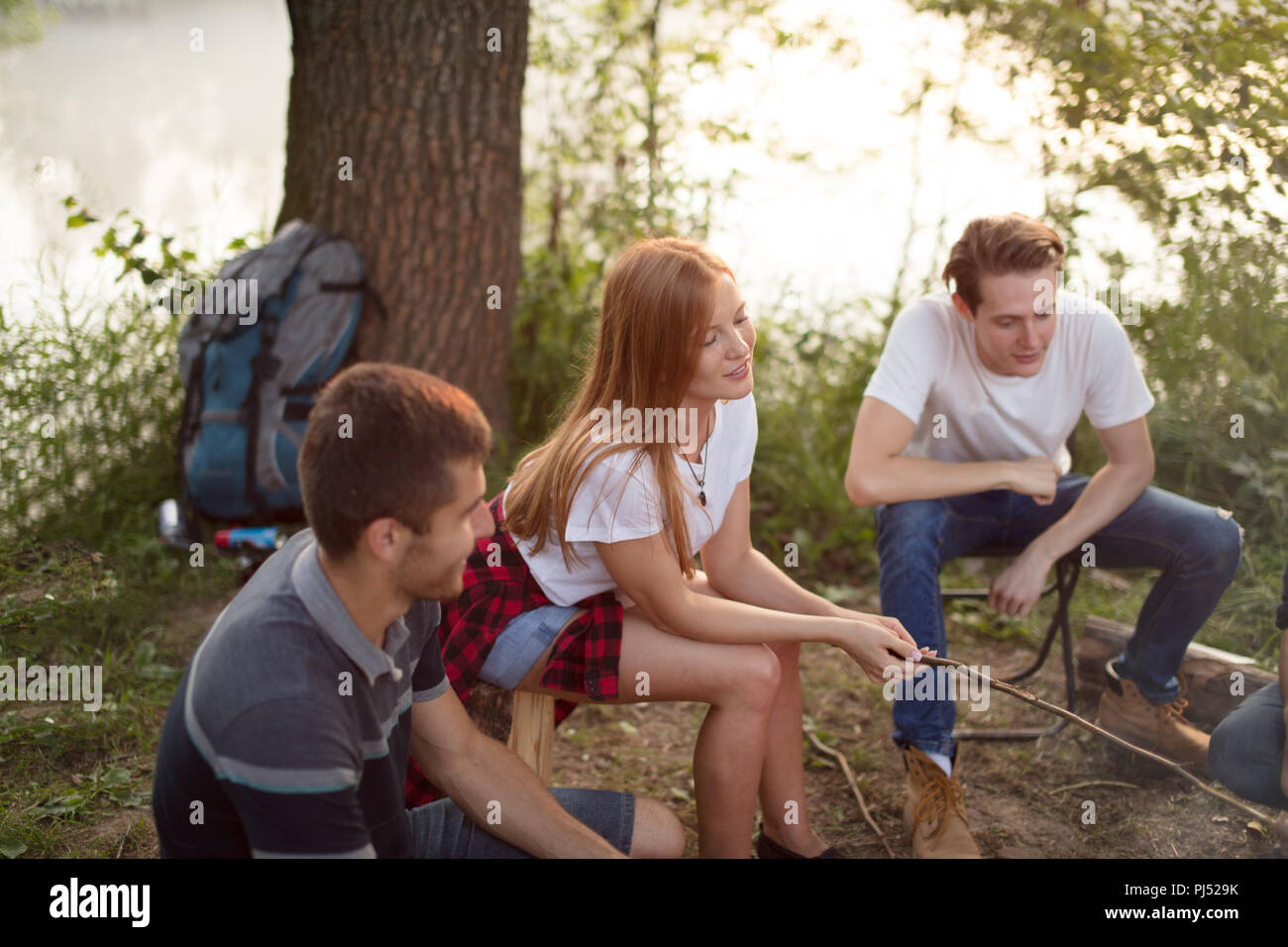 close up side view photo. smiling friends Stock Photo - Alamy