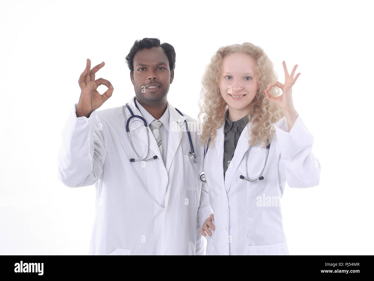two doctors of the medical center showing OK gesture Stock Photo - Alamy