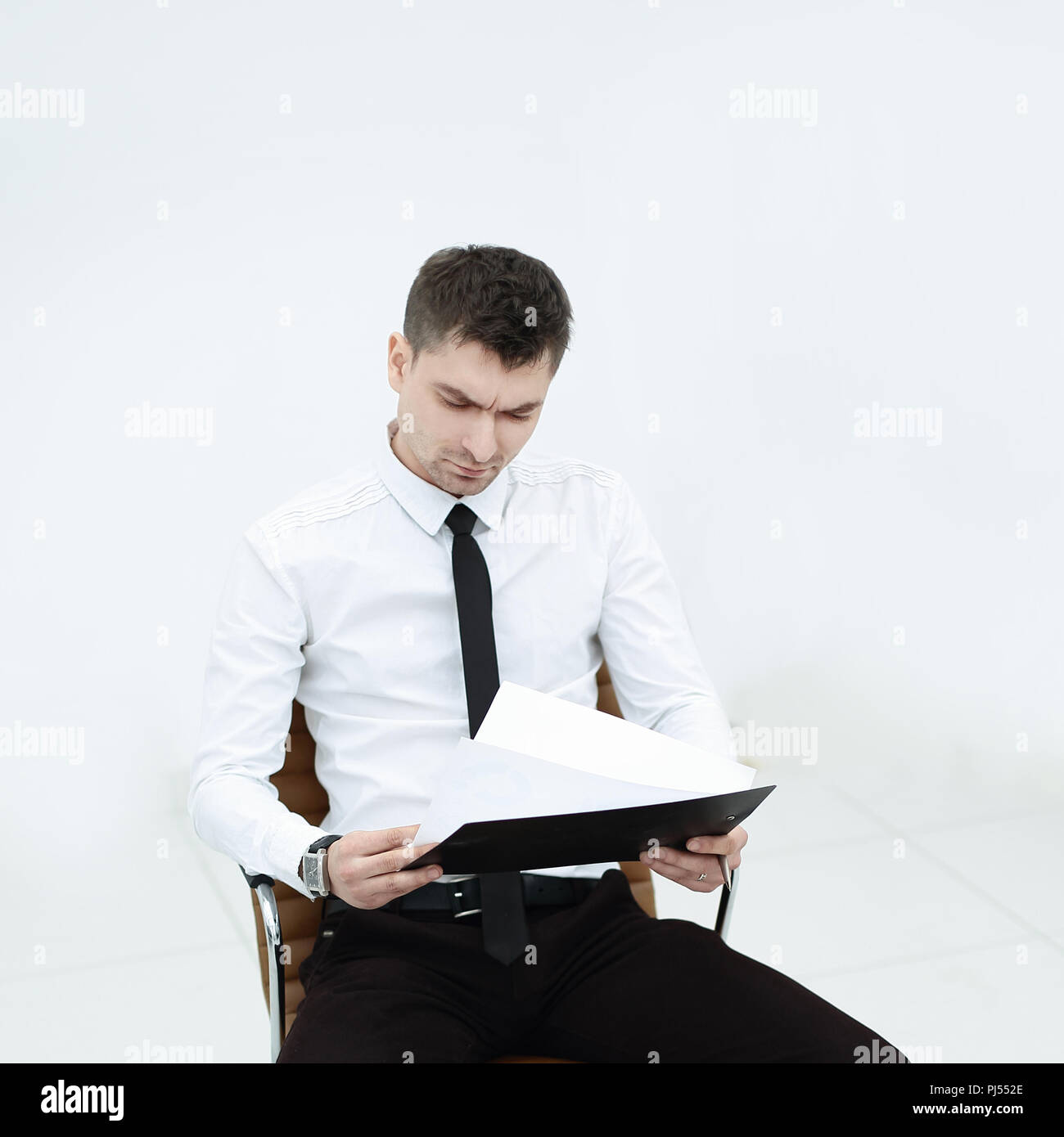 attentive businessman with clipboard sitting on office chair Stock ...