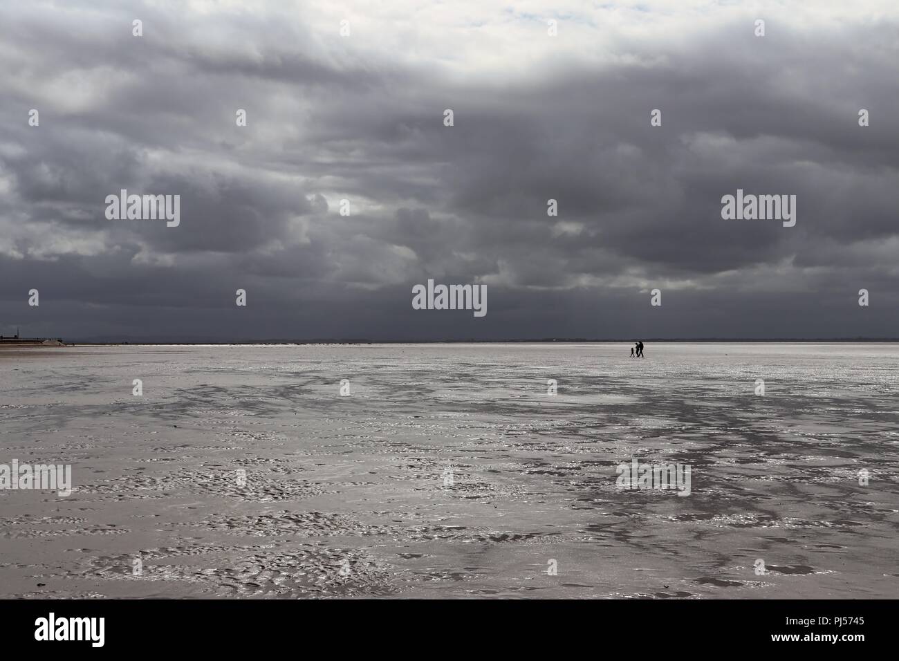 Bright Sand and Dark Sky, St Annes, UK Stock Photo - Alamy