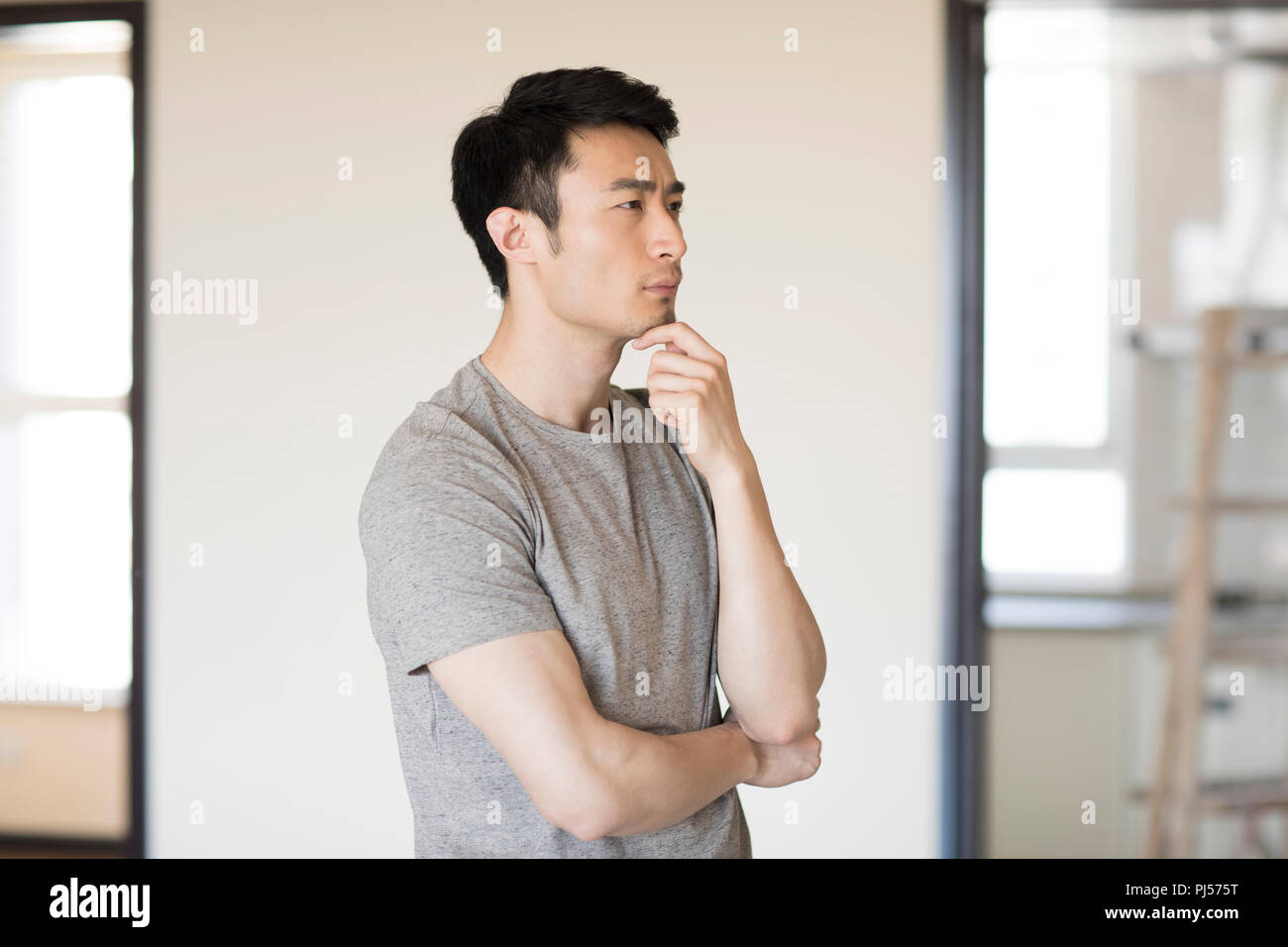 Young man designing home renovation Stock Photo - Alamy