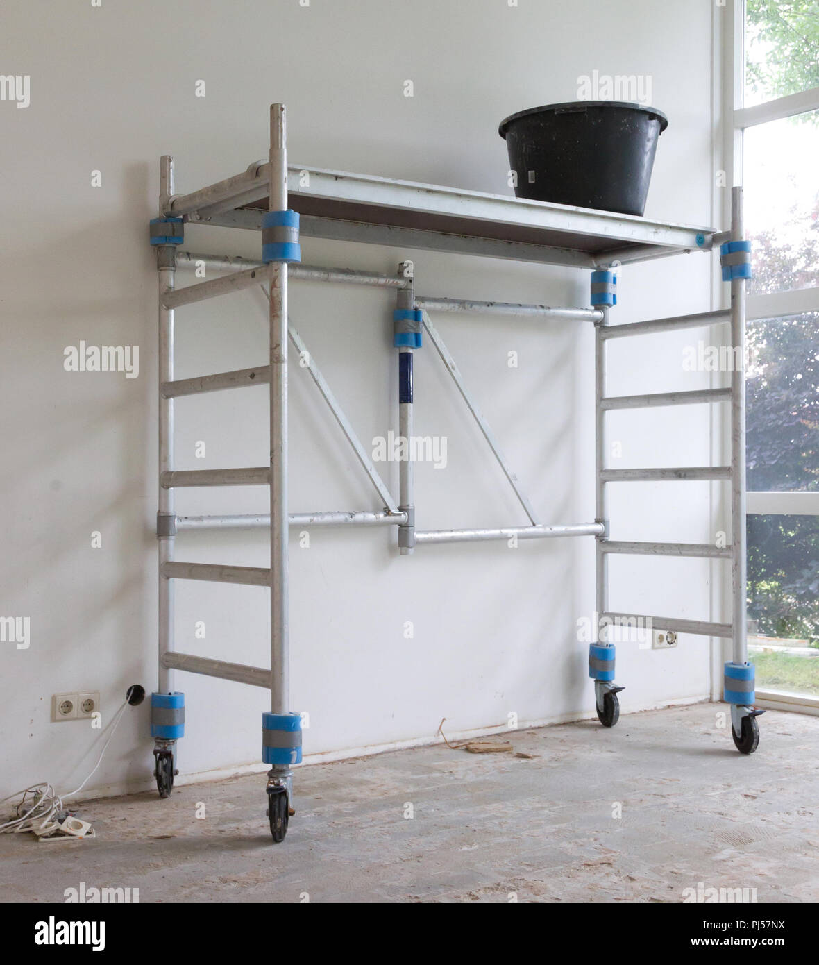 Worker tools - Bucket standing on rolling scaffolding (plaster work ...