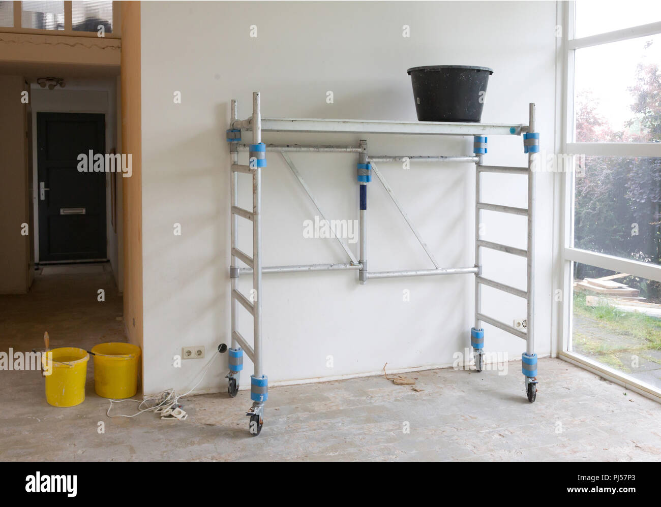 Worker tools - Bucket standing on rolling scaffolding (plaster work ...
