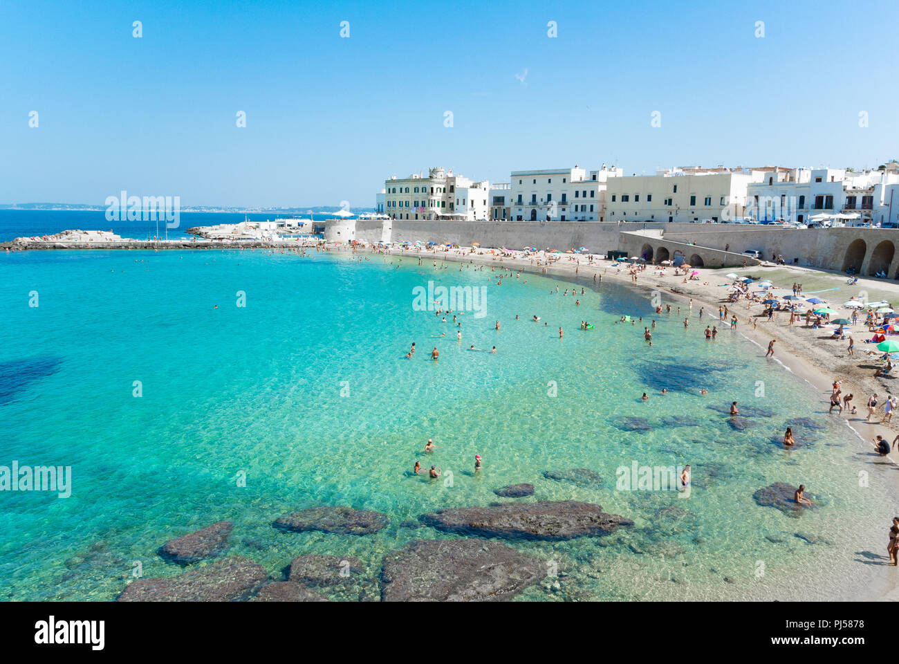 Panoramic view of public beach with italian people, Gallipoli, Lecce ...
