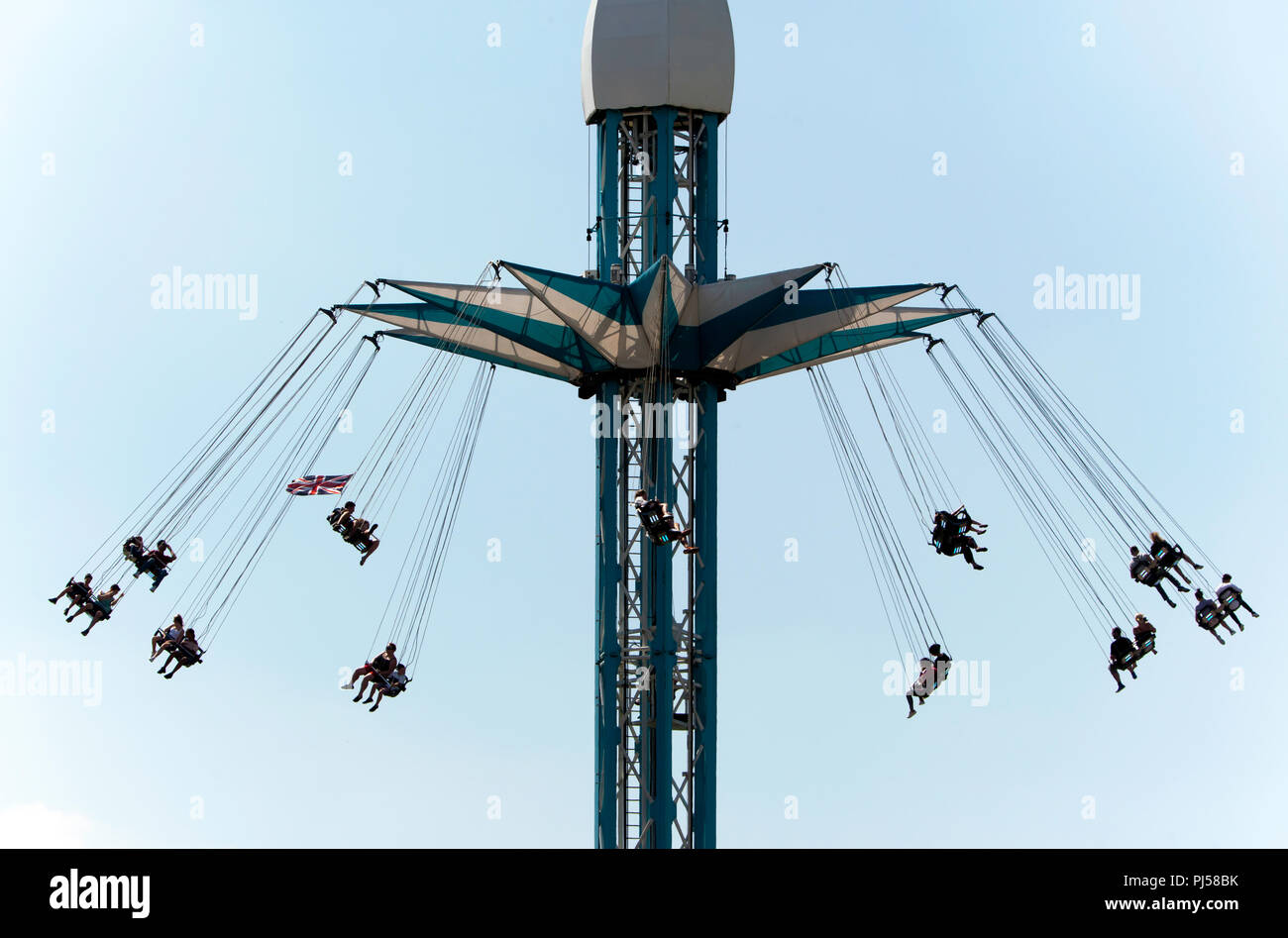 Close-up of people enjoying the Starflyer ride, above London's South ...