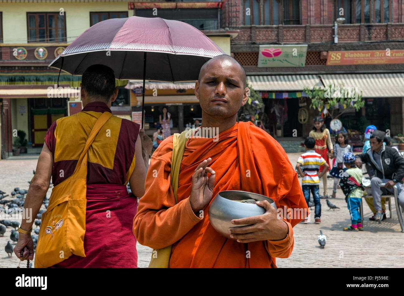 Kathmandu, Nepal - April 15, 2016: Unidentified monk with bowl standing ...