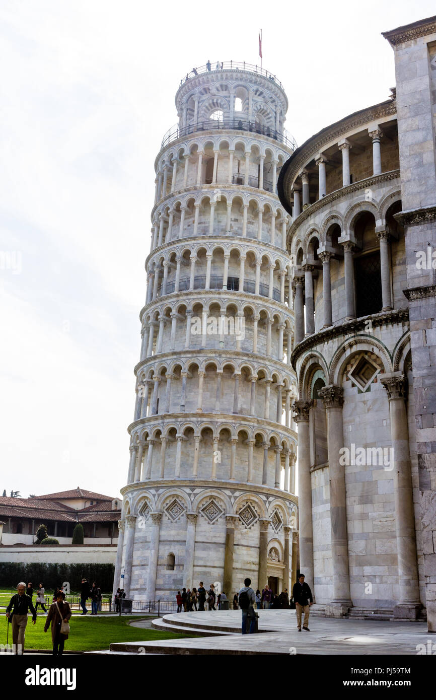 Pisa, Italy - March 17, 2012: People walking near the Tower of Pisa ...