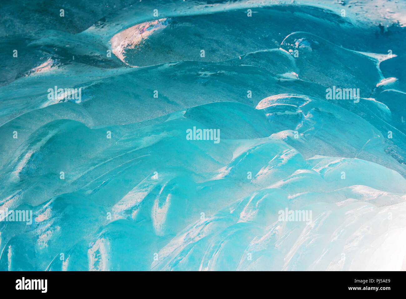 Detail of an ice wall inside the ice cave of the Mer de Glace glacier ...