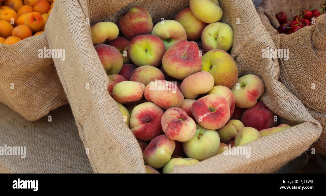 box of fresh saturn peaches also called chinese peaches or ufo peach ...