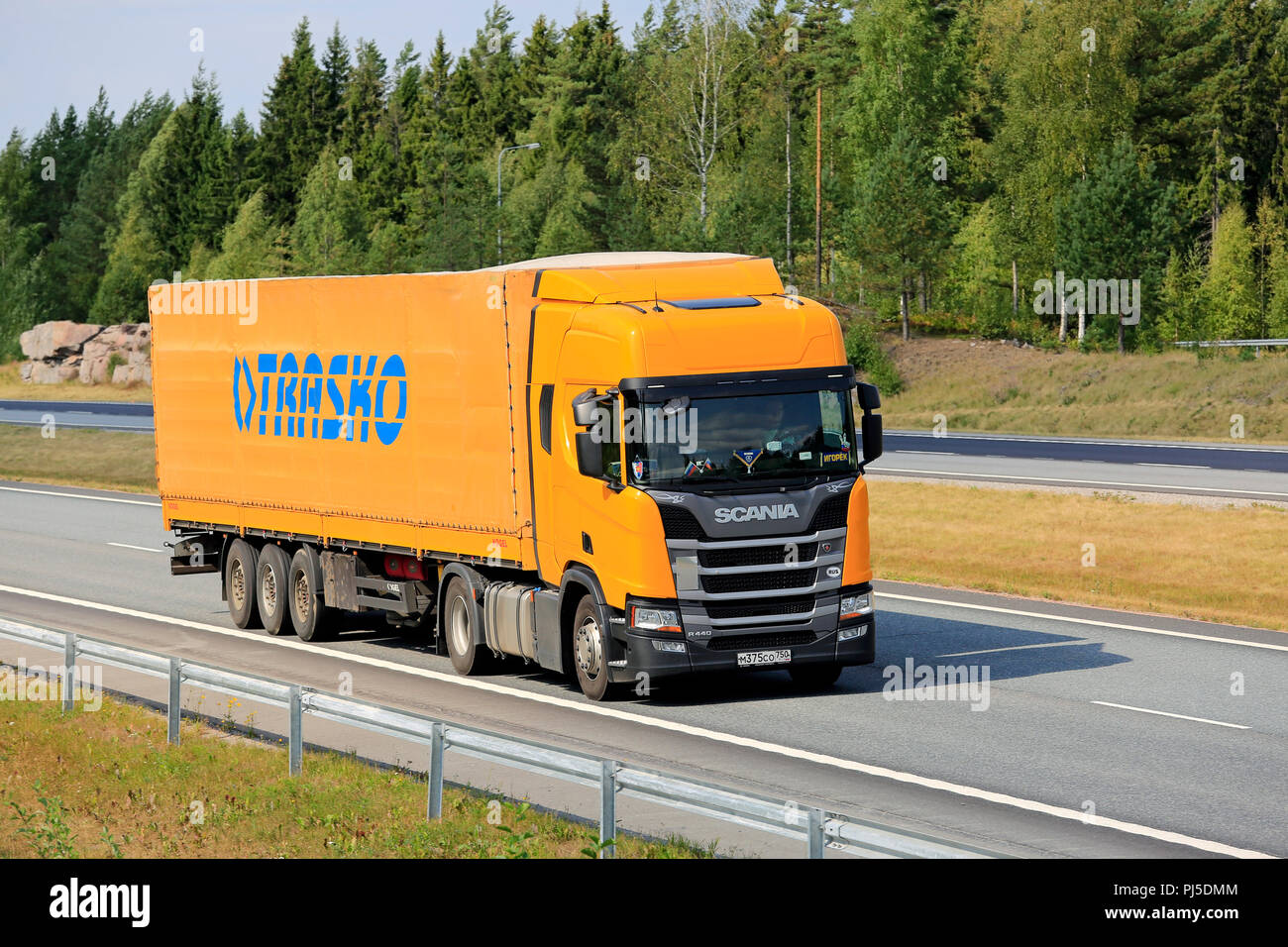 Yellow Next Generation Scania R440 semi trailer of Trasko hauls goods ...