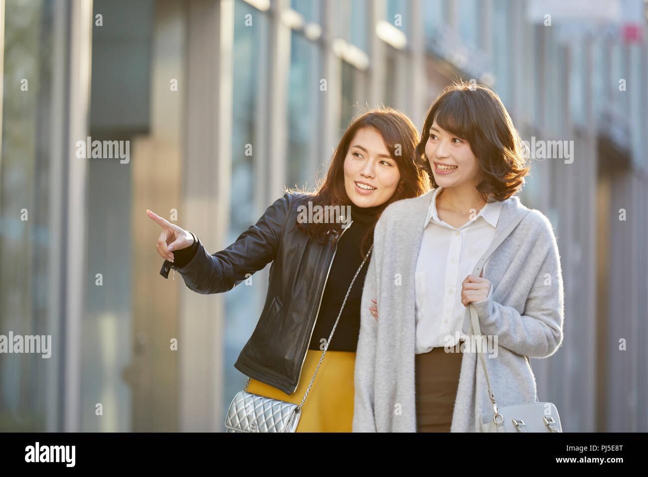 Japanese women window shopping downtown Tokyo Stock Photo - Alamy
