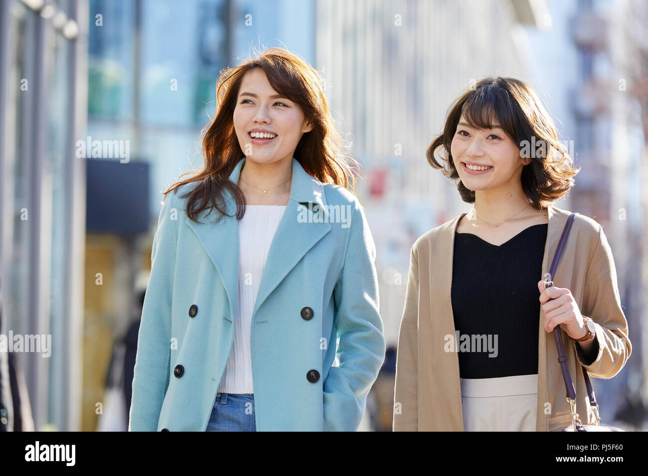 Japanese women window shopping downtown Tokyo Stock Photo - Alamy