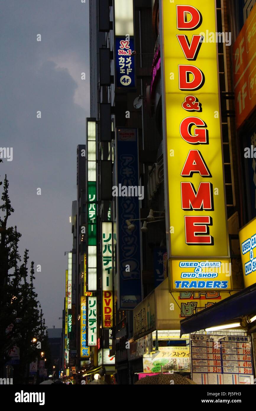 Bright signs in Tokyo night Stock Photo - Alamy