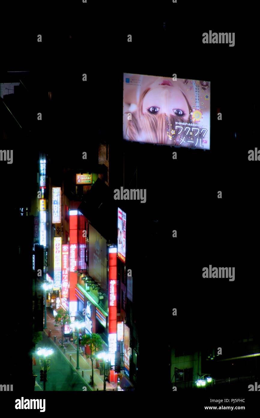 Bright signs in Tokyo night Stock Photo - Alamy