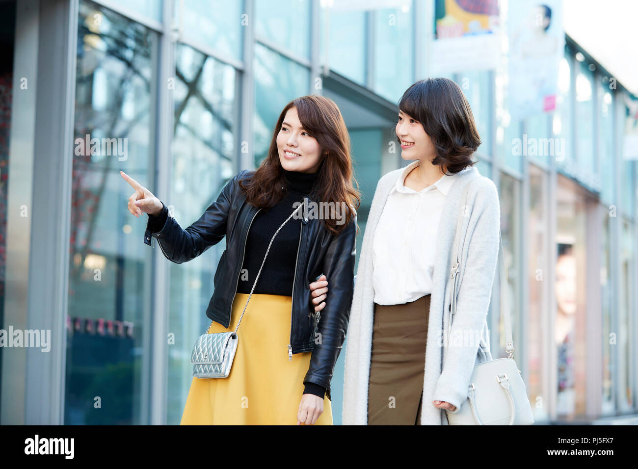 Japanese women window shopping downtown Tokyo Stock Photo - Alamy